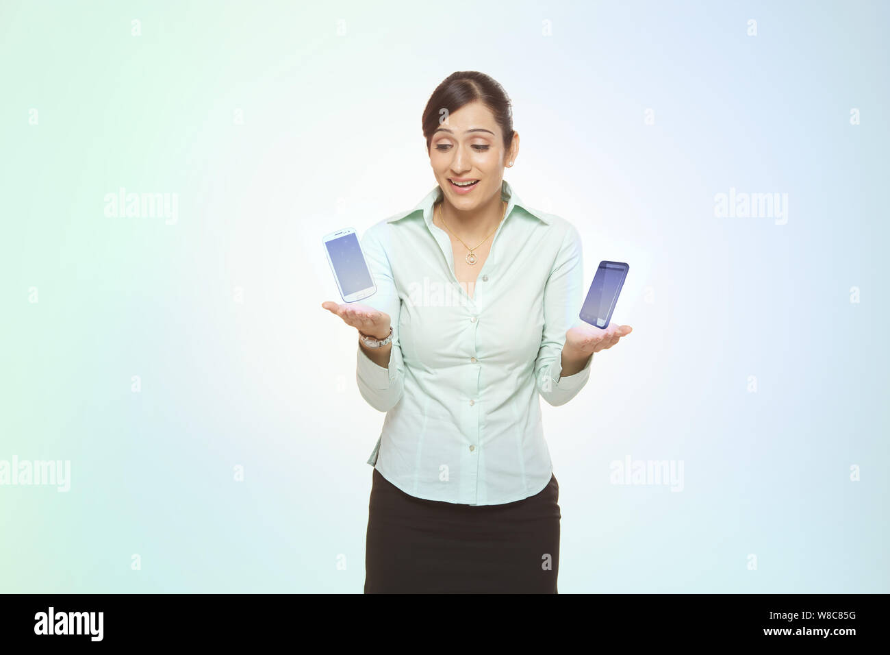 Comparing phones hi-res stock photography and images - Alamy