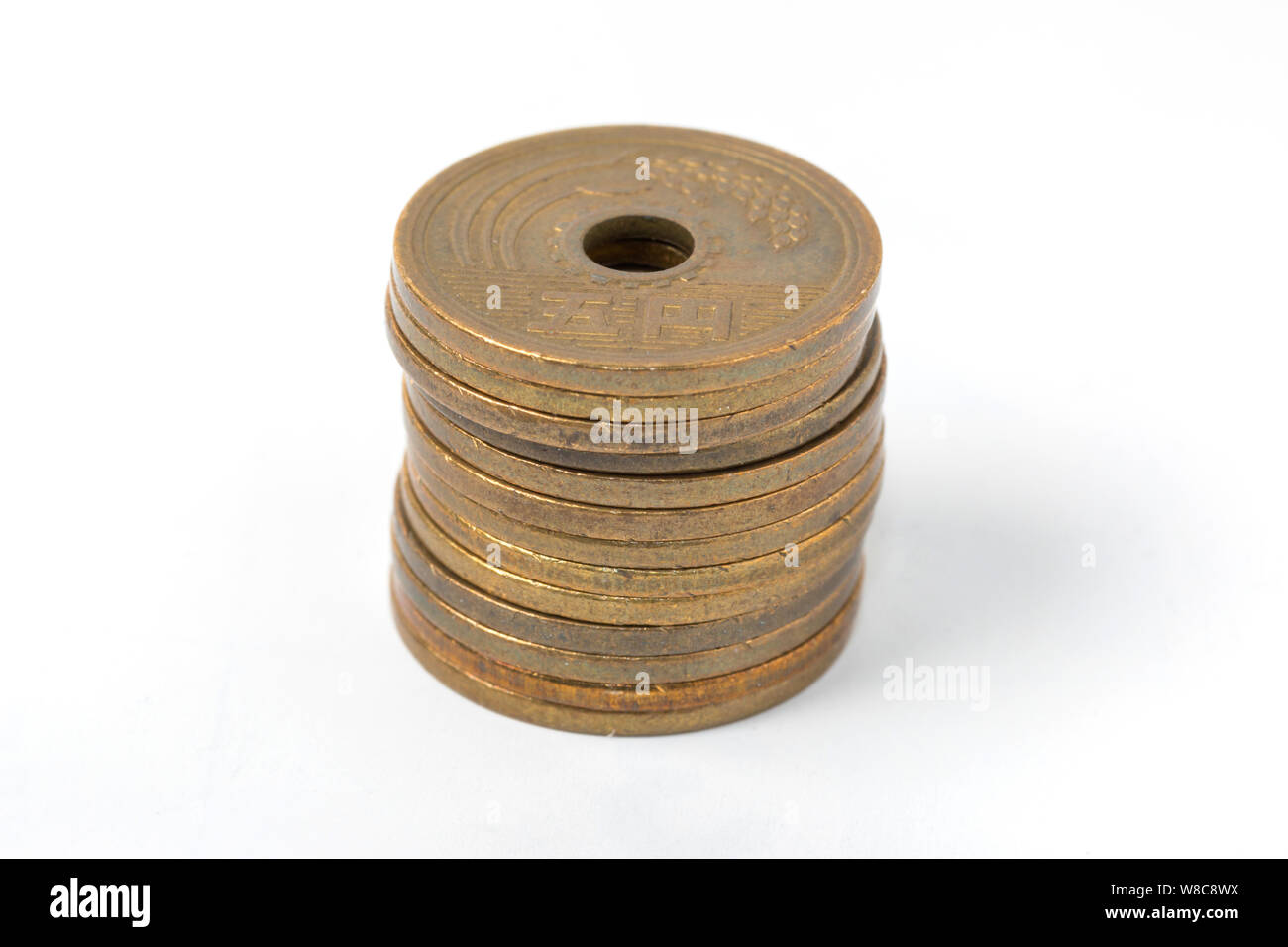 Pile of 5 yen coins japanese money, close up on white background Stock ...