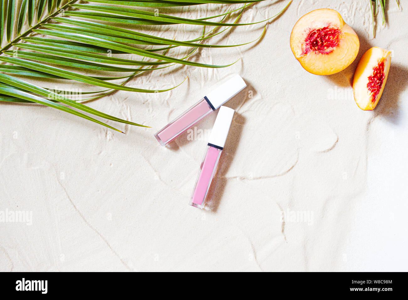 Wonderful beach. Decorative cosmetics, lipstick, lip gloss, lip balm ...
