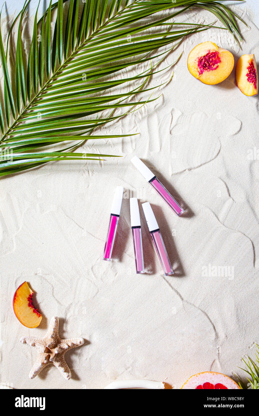 Wonderful beach. Decorative cosmetics, lipstick, lip gloss, lip balm ...