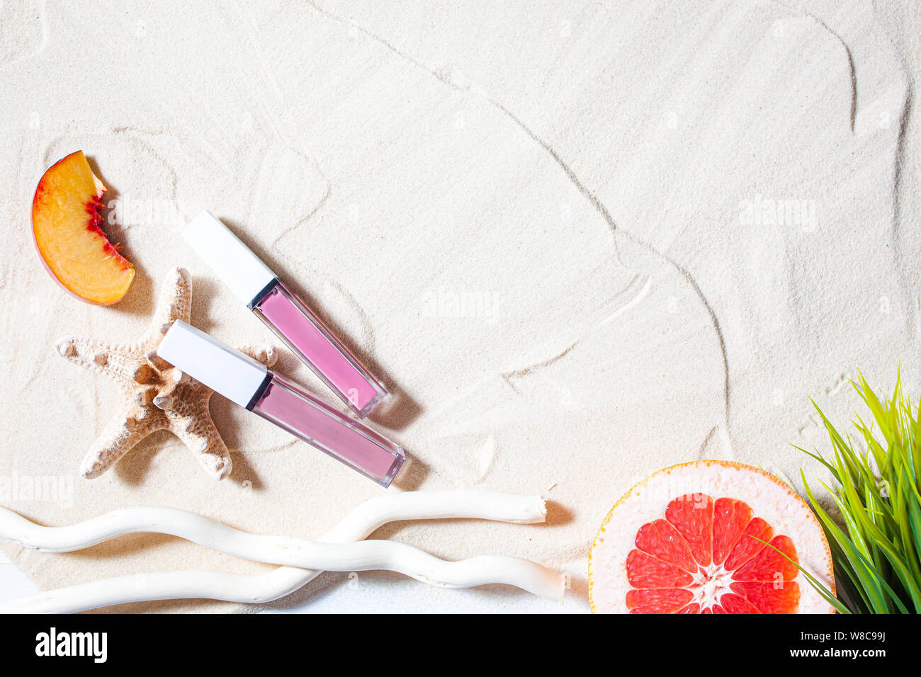 Wonderful beach. Decorative cosmetics, lipstick, lip gloss, lip balm ...