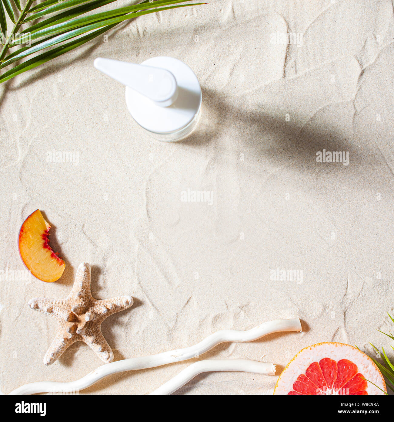 Safe sun. Skin care. A transparent bottle with a dispenser stand on the ...