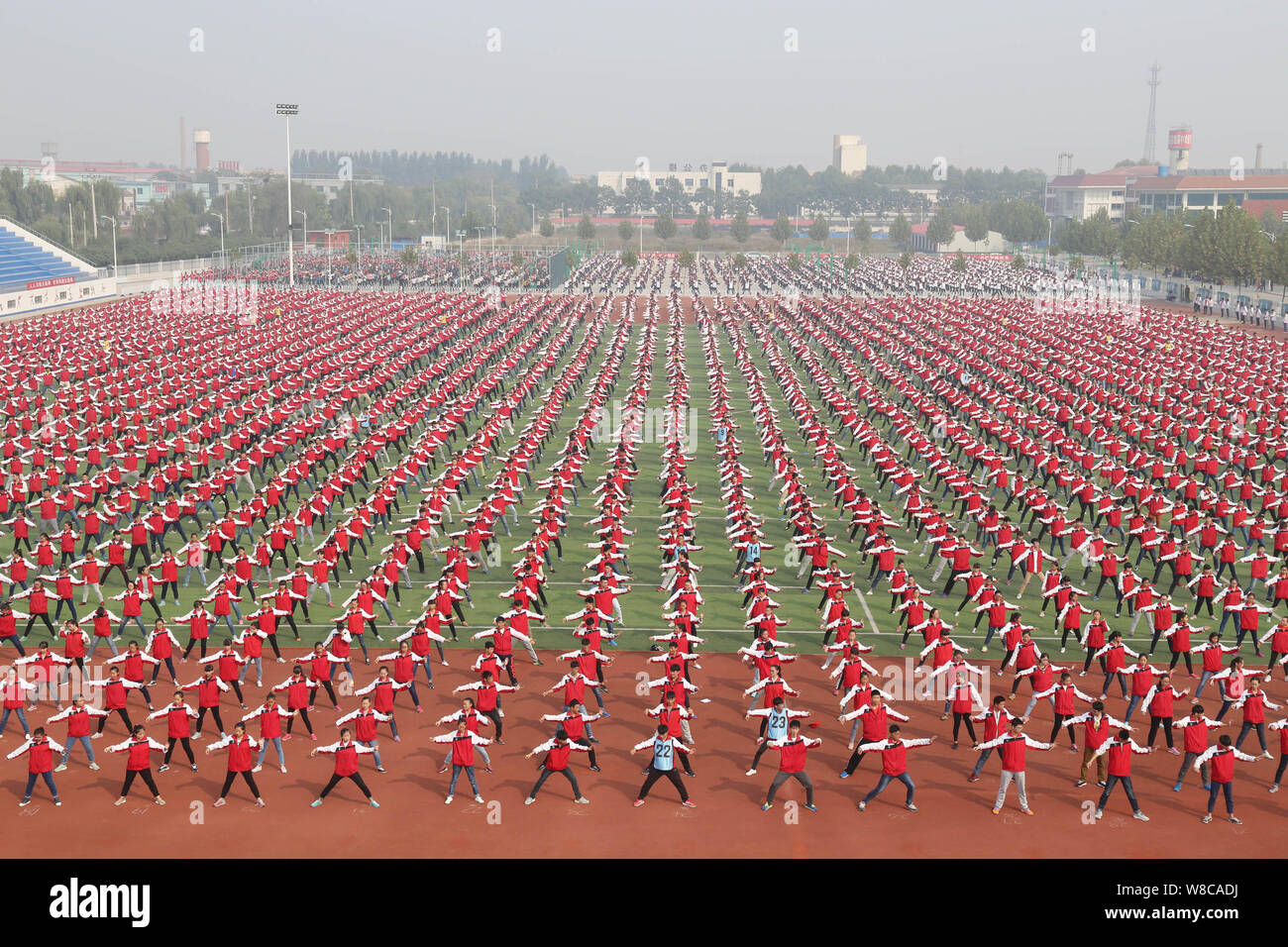Participants perform shadow-boxing (Taiji, Taichi or Tai-chi) during an ...