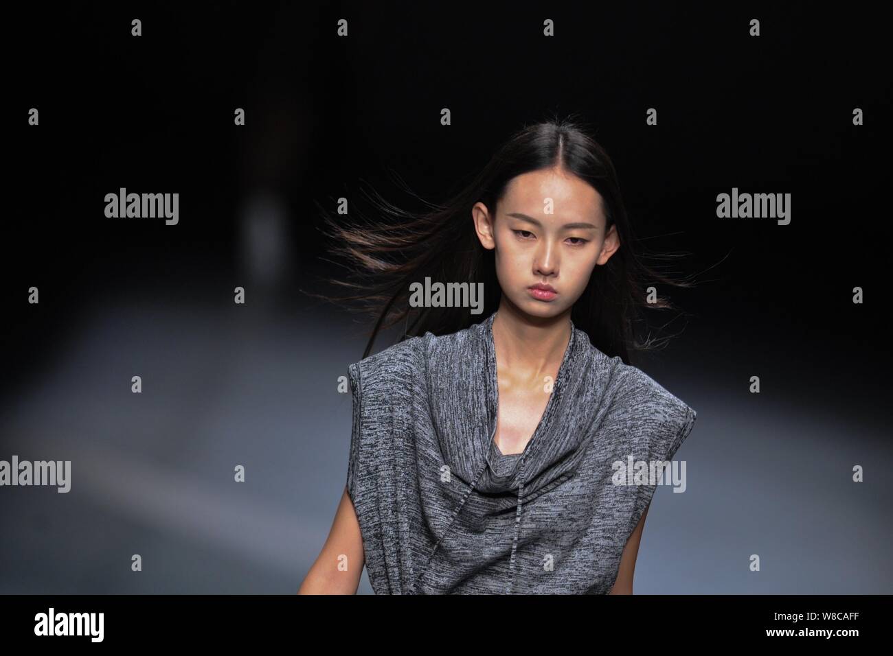 A model displays a new creation at the Harrison Wong fashion show of ...