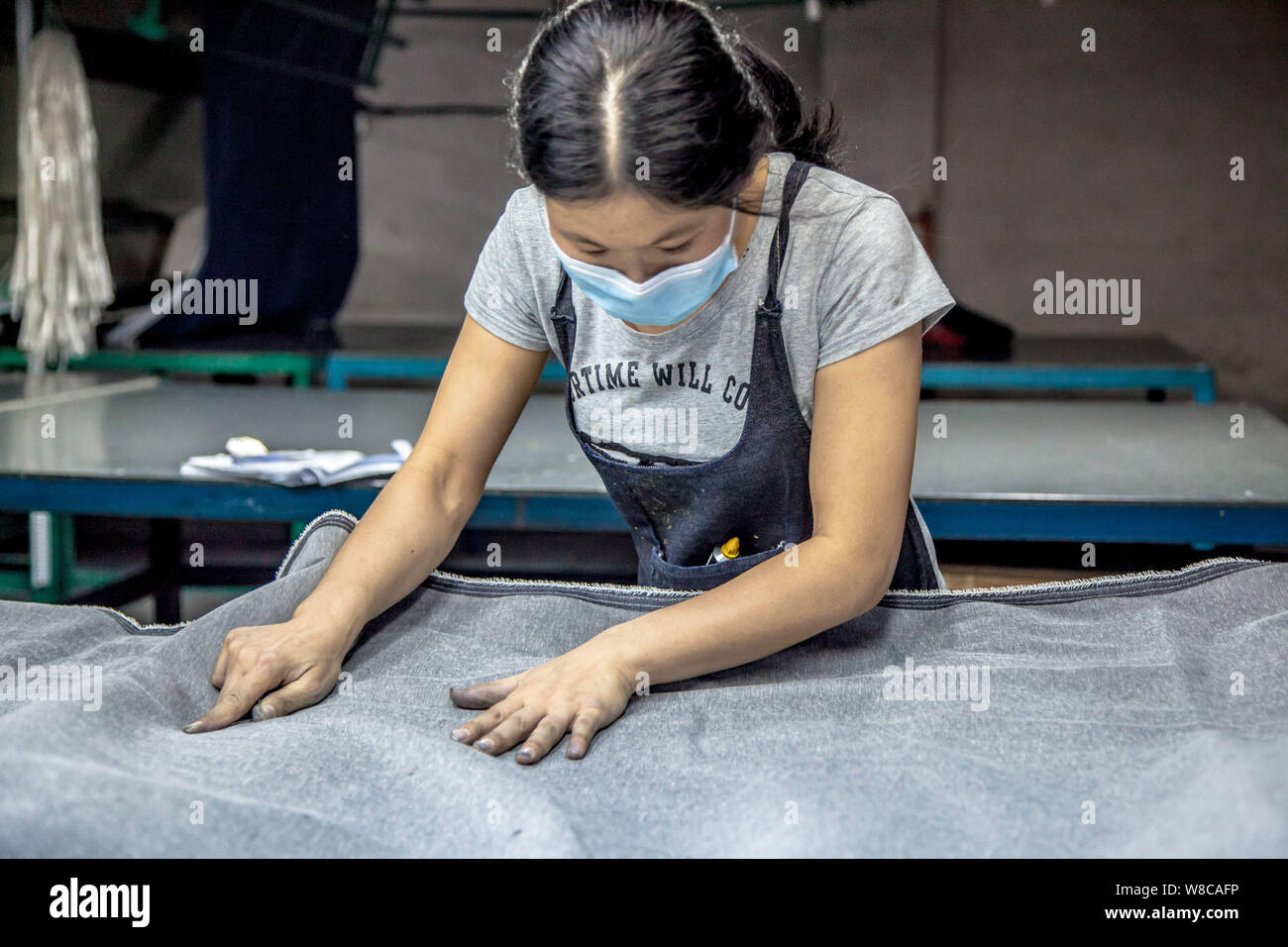Female chinese worker checks hi-res stock photography and images - Alamy