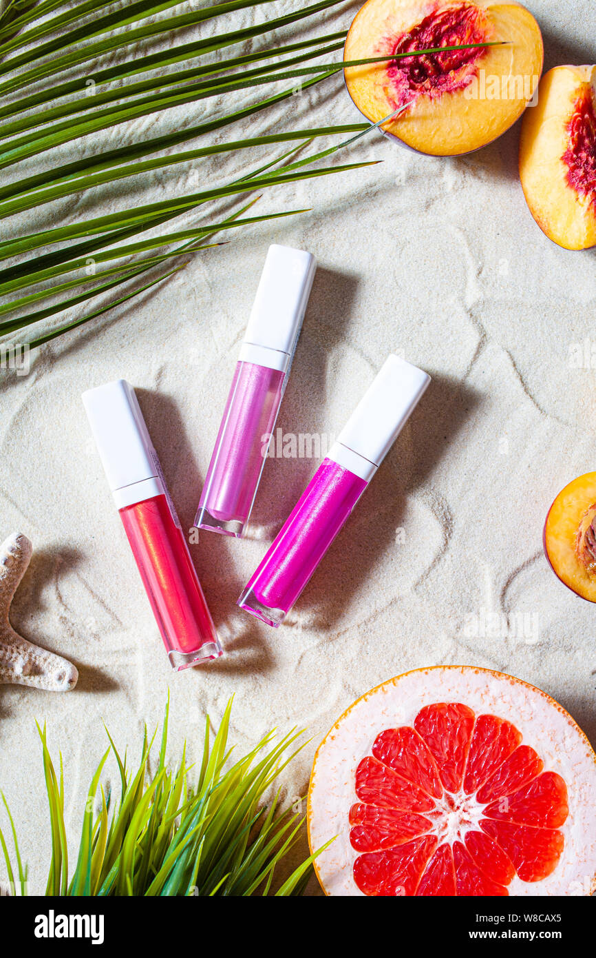 Wonderful beach. Decorative cosmetics, lipstick, lip gloss, lip balm ...