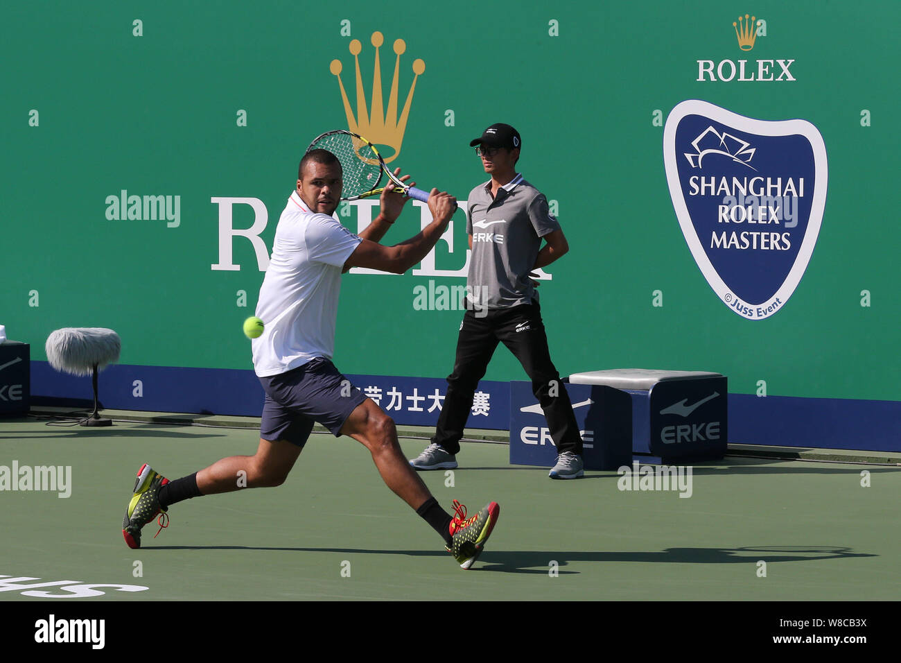 Jo-Wilfried Tsonga of France returns a shot to Albert Ramos-Vinolas of Spain in their third ...