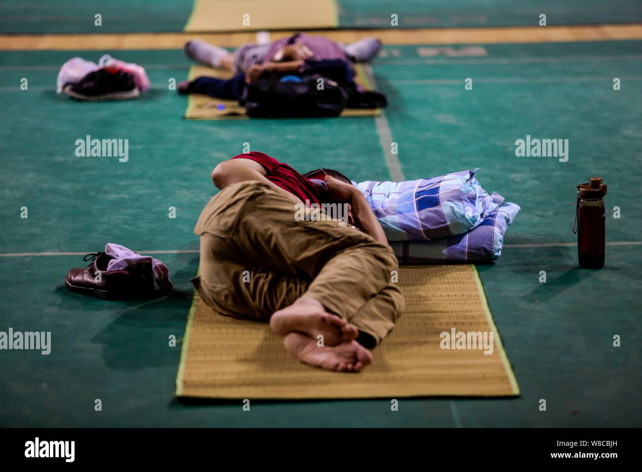 Children sleeping on floor mats hi-res stock photography and images - Alamy