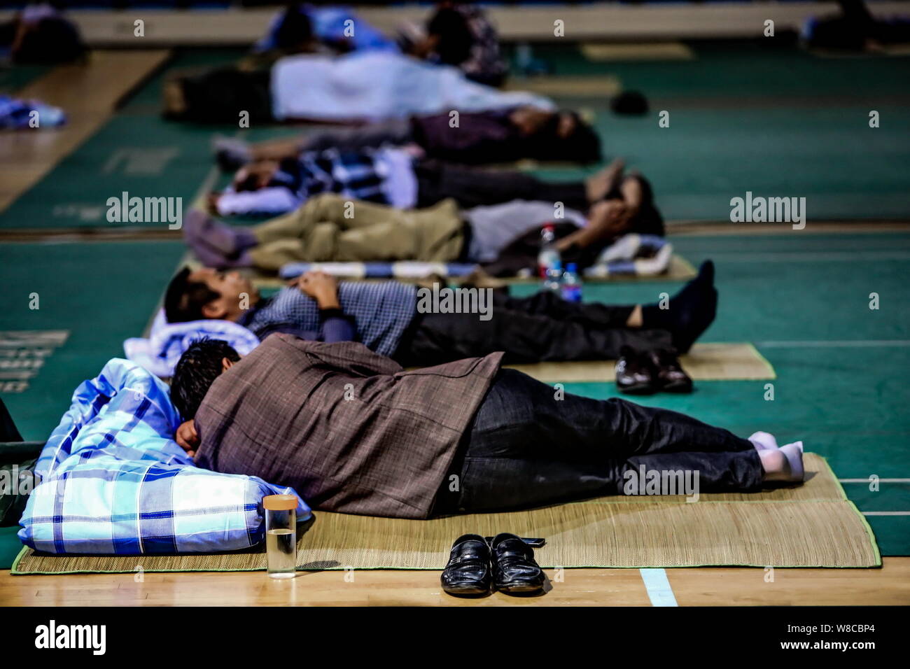 Children sleeping on floor mats hi-res stock photography and images - Alamy