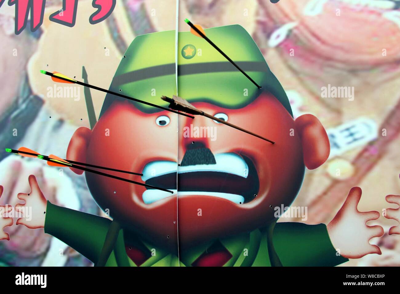 A board featuring cartoon images of Japanese soldiers during World War ...