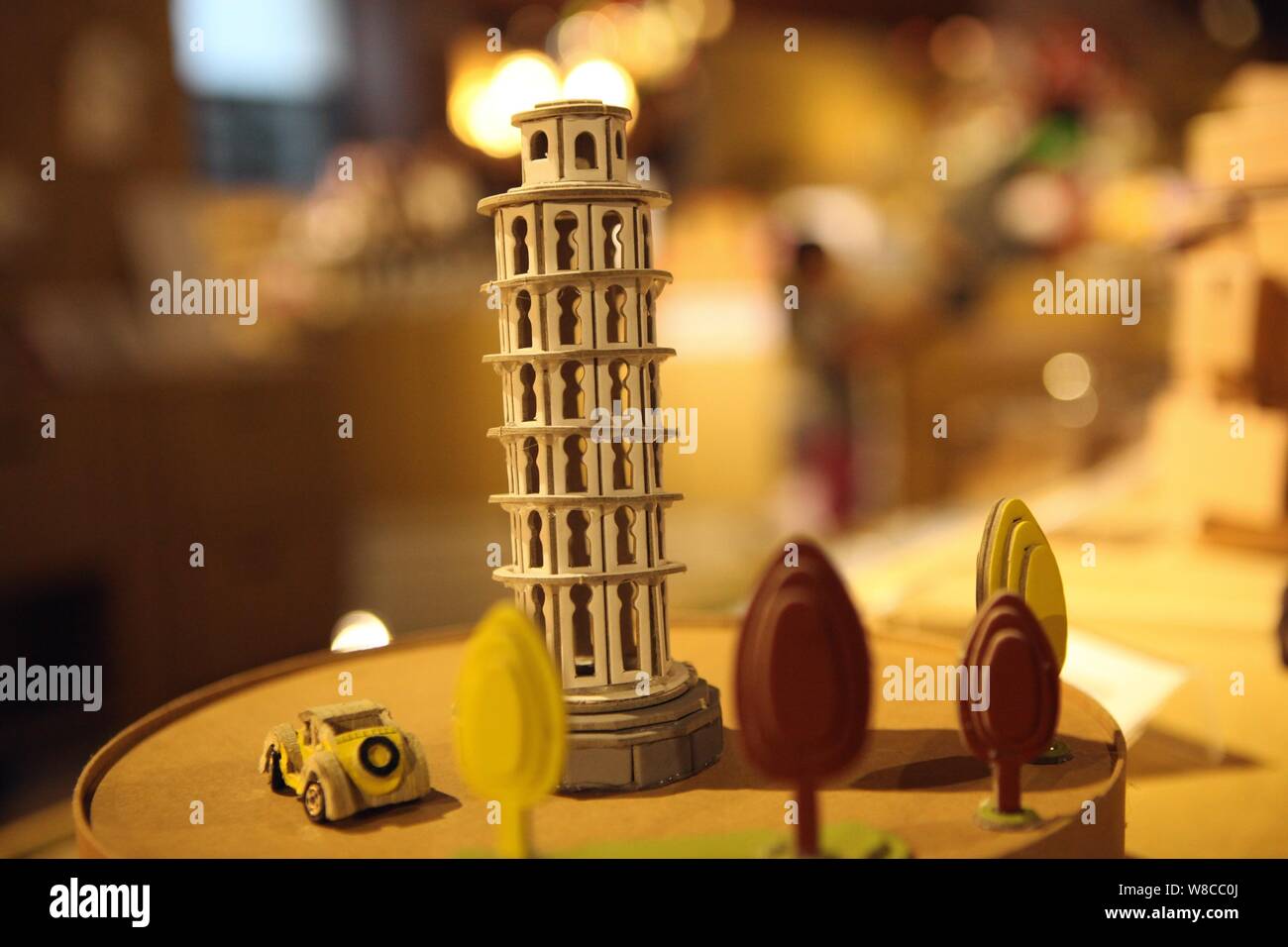 A leaning tower of Pisa made of corrugated paper is on display at the ...