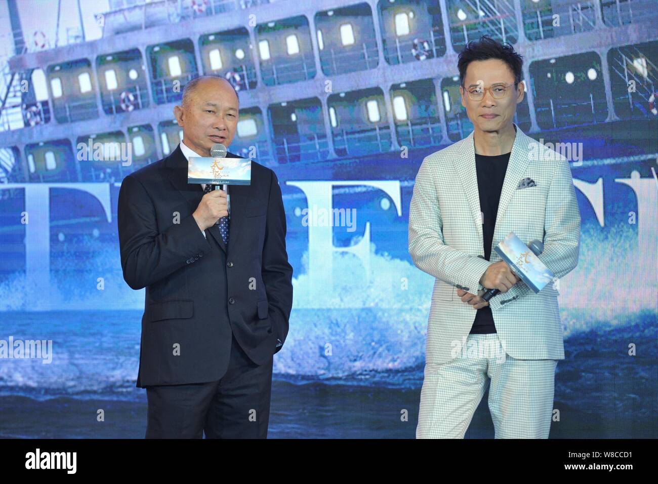 Hong Kong directory John Woo, left, speaks next to Taiwanese singer ...