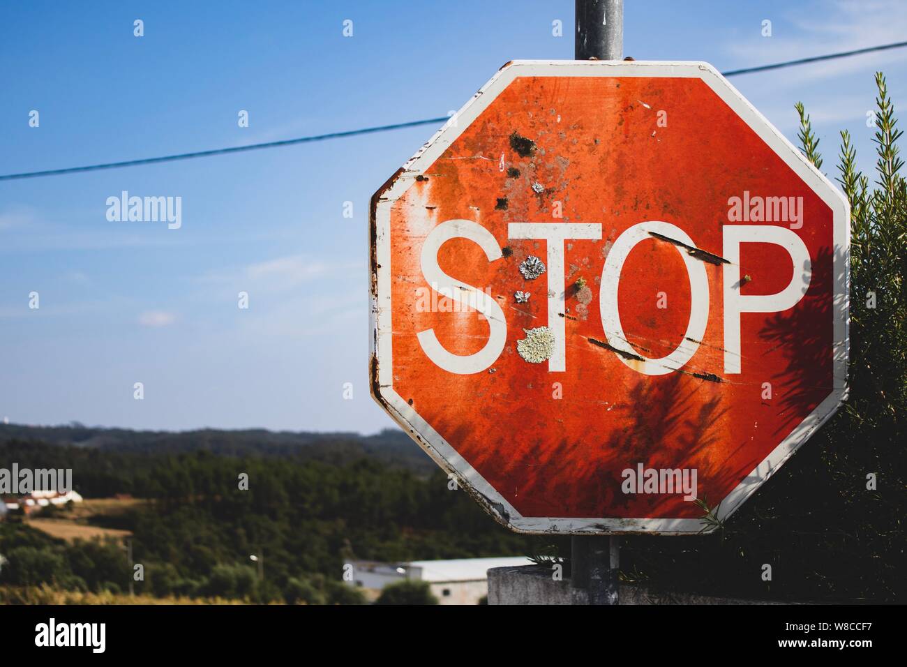 Stop sign with a beautiful background. Peaceful rural area view. Summer ...