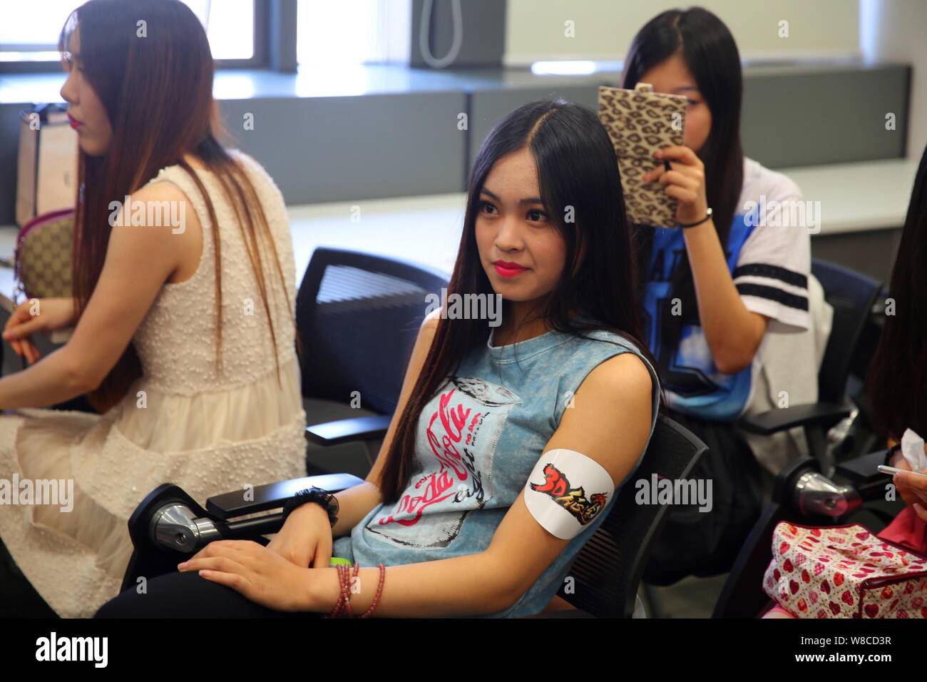 Young Chinese girls take part in an interview and test to be selected ...