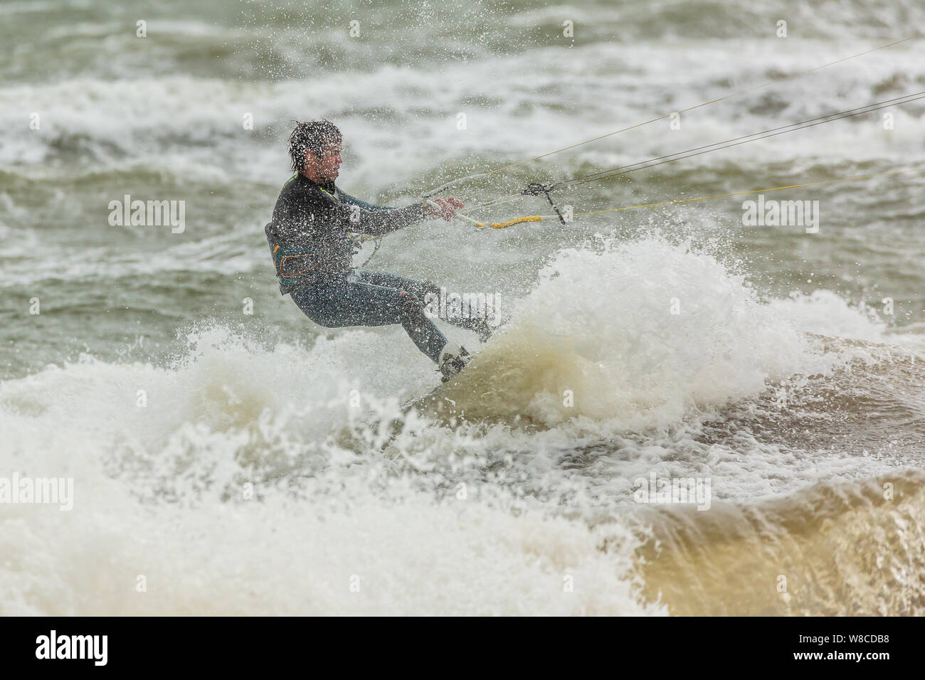 Melbourne, Australia. 9th August, 2019. A lone Kite Surfer braces the ...