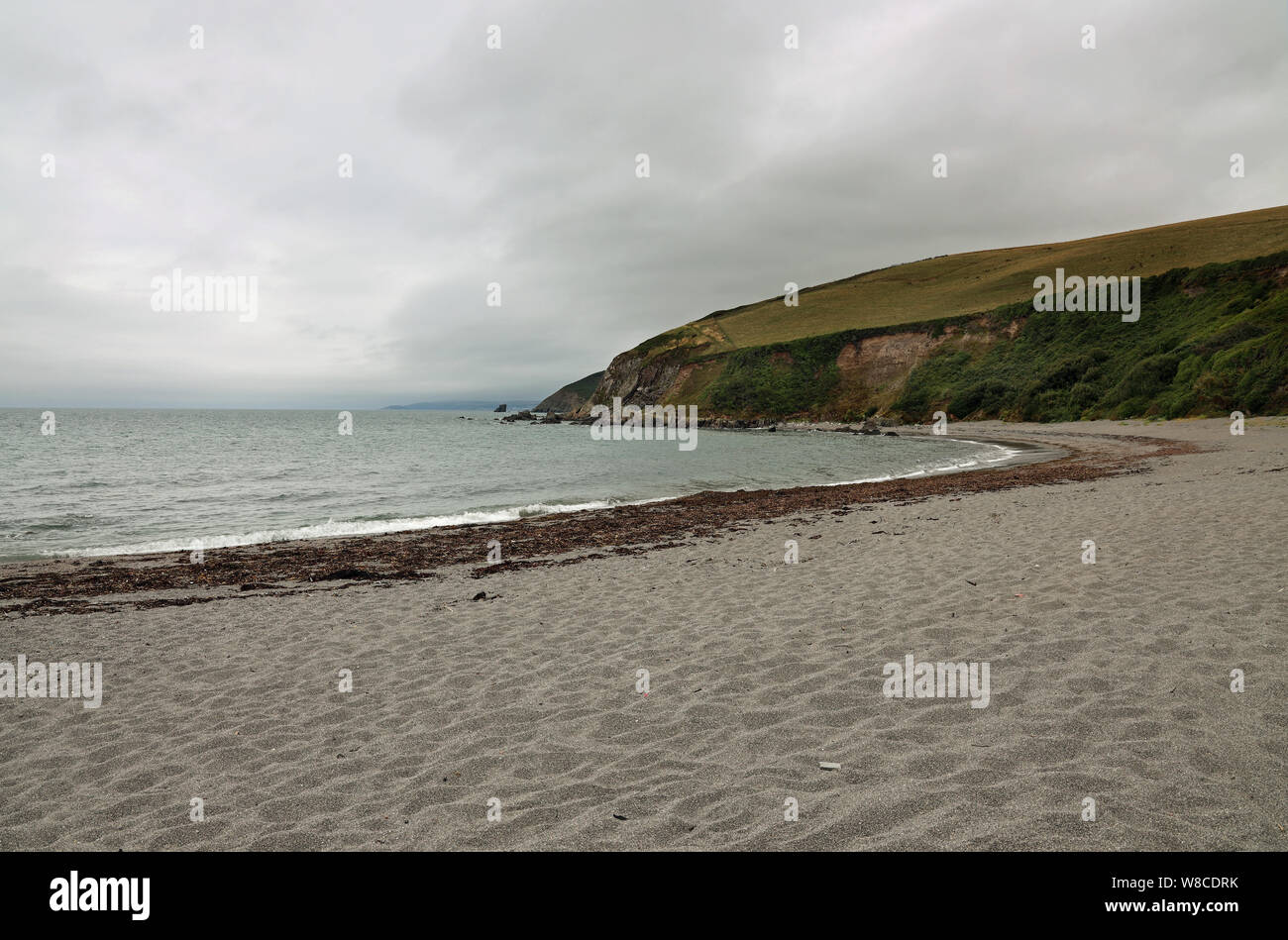 A deserted beach at Portwrinkle in south east Cornwall on an overcast ...