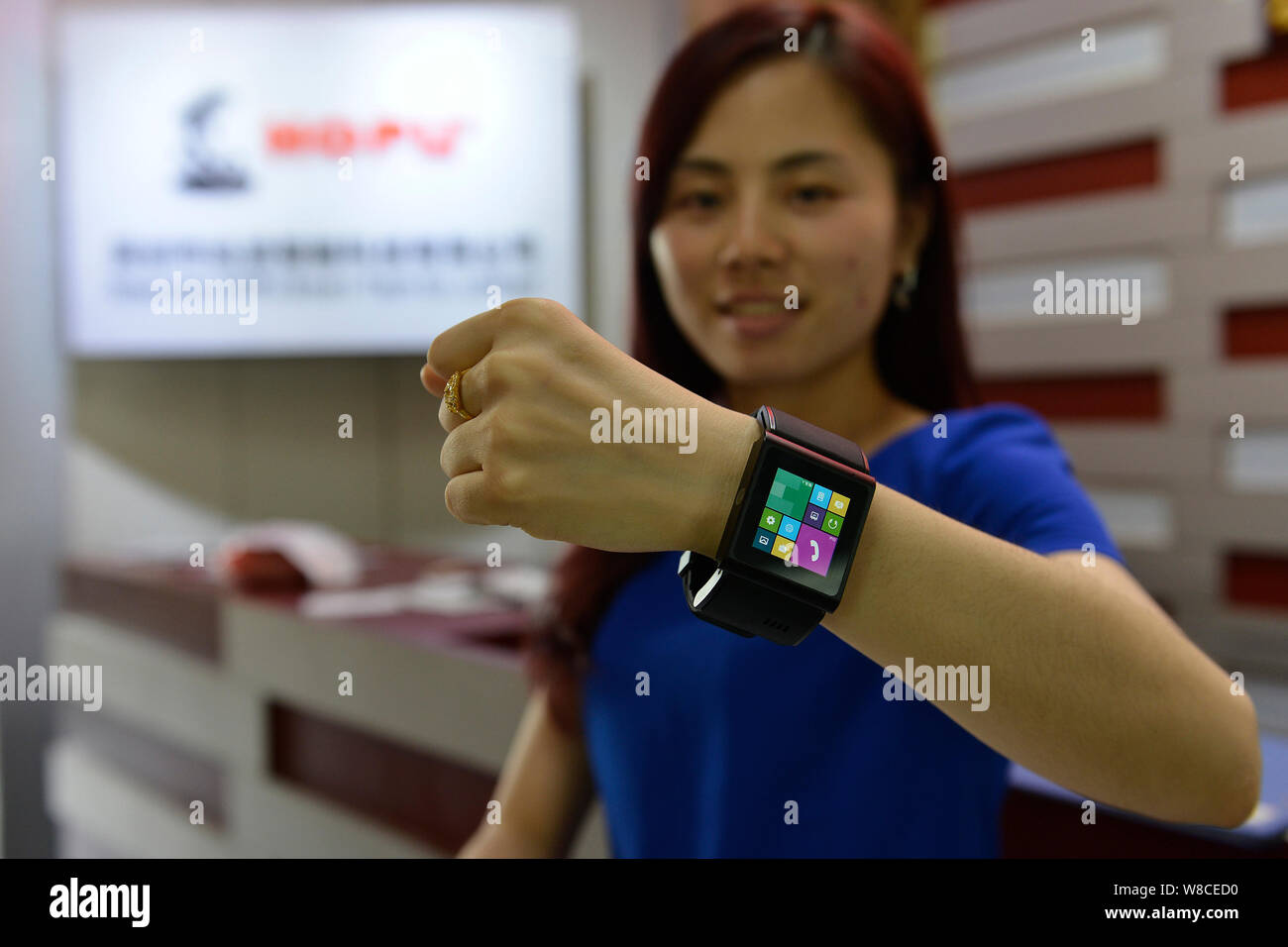 Chinese employee shows smart hi-res stock photography and images - Alamy