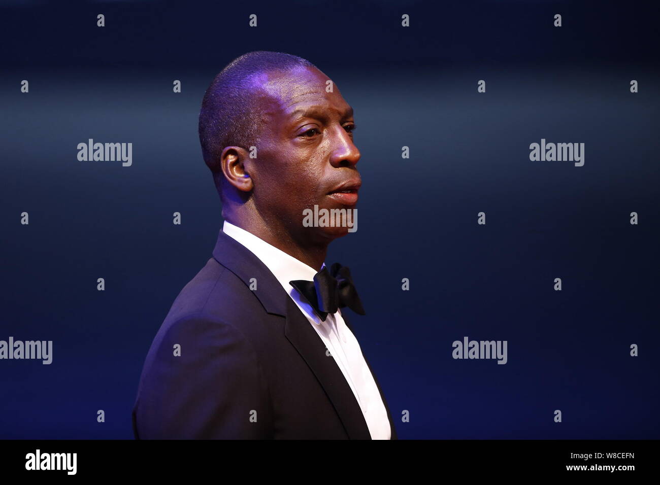 Retired Chinese sprinter Michael Johnson poses on the red carpet for ...