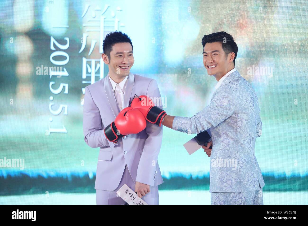 Chinese actors Huang Xiaoming, left, and Shen Tai interact during a ...