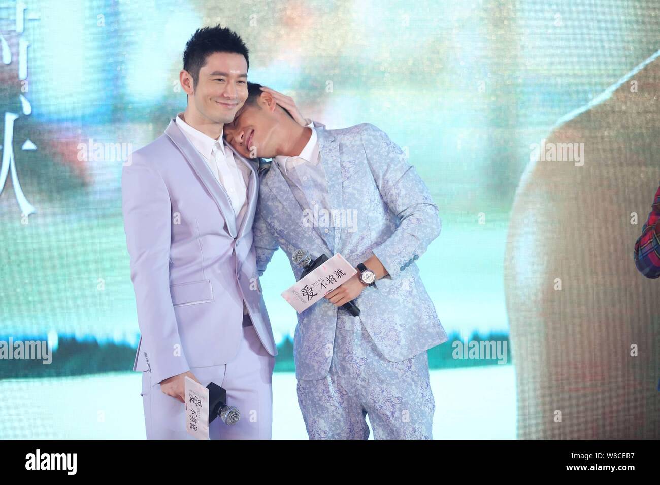 Chinese actors Huang Xiaoming, left, and Shen Tai interact during a ...