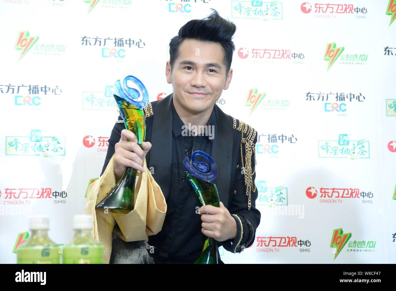 Taiwanese singer Gary Chaw poses with his trophies during the 22th ...