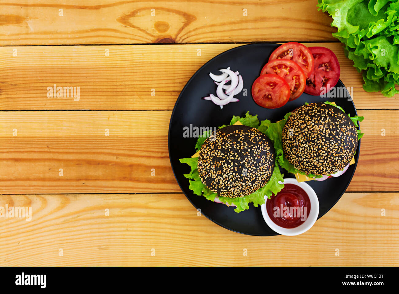 Handmade burger on dark background. Delicious black burger Stock Photo ...