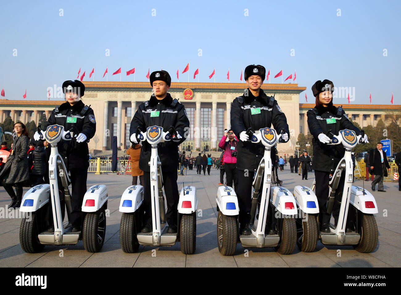 Chinese police officers ride Segway-like two-wheeled electric vehicles ...