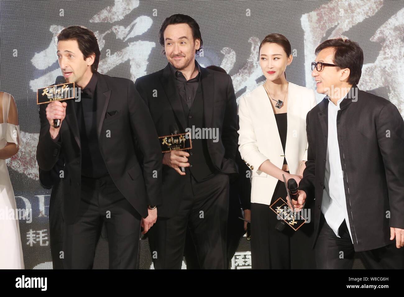 (From left) American actors Adrien Brody, John Cusack, Chinese actress ...