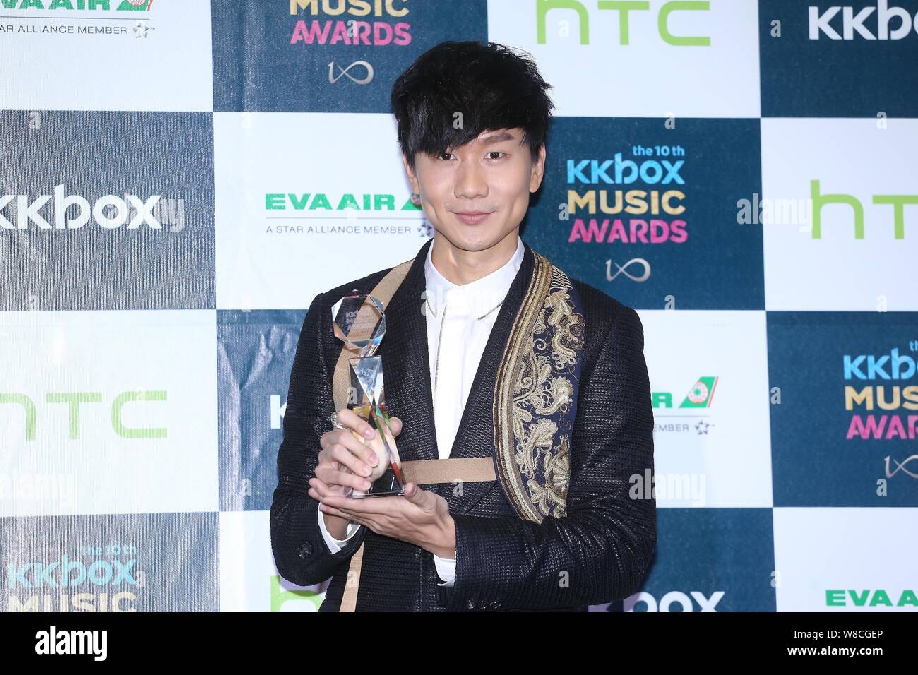 Singaporean singer JJ Lin poses with his trophy during the 10th KKBOX ...