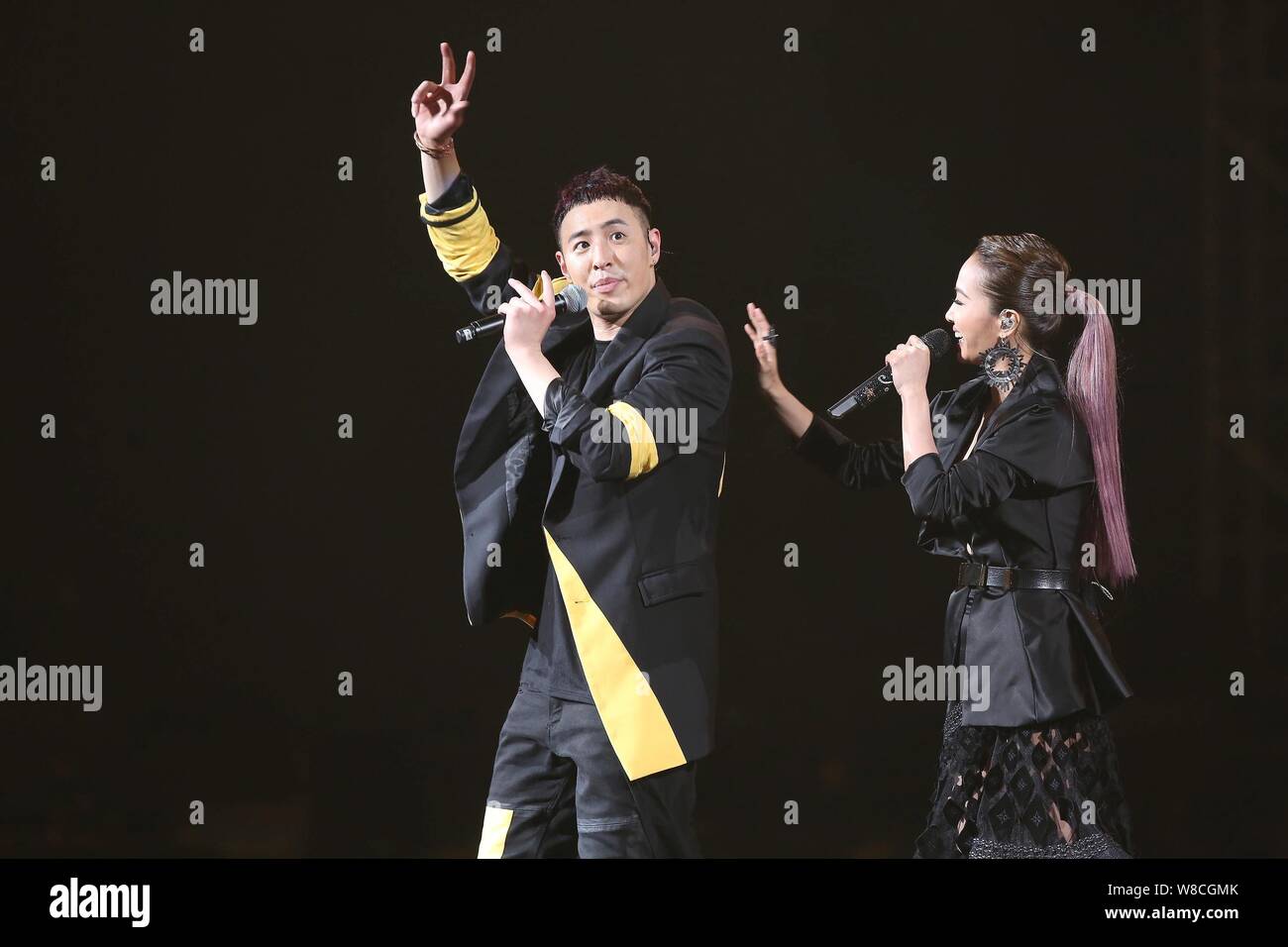 Taiwanese singers Jolin Tsai, right, and Wilber Pan perform at Pan's ...