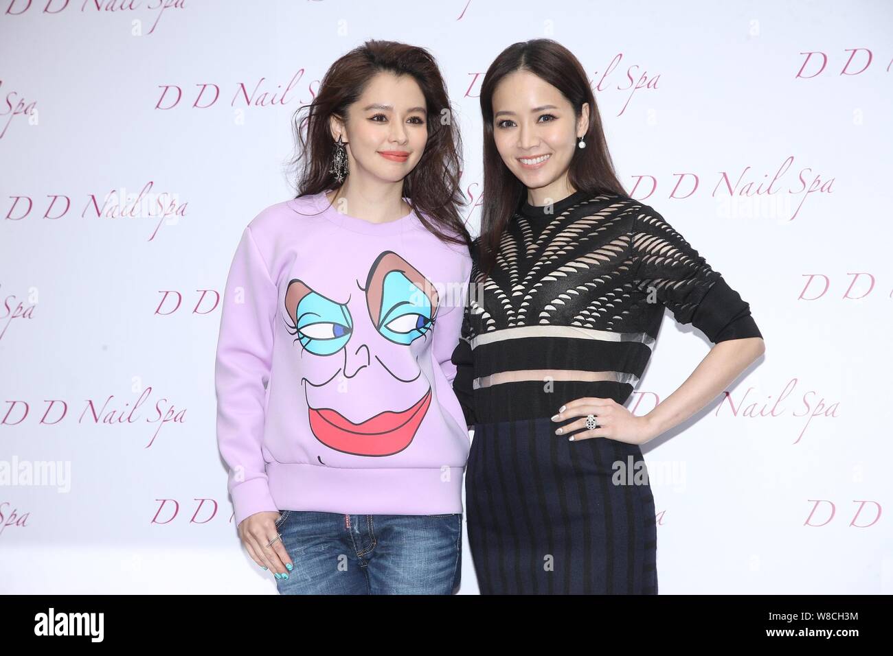 Taiwanese actress Vivian Hsu, left, and TV hostess Patty Hou pose at ...