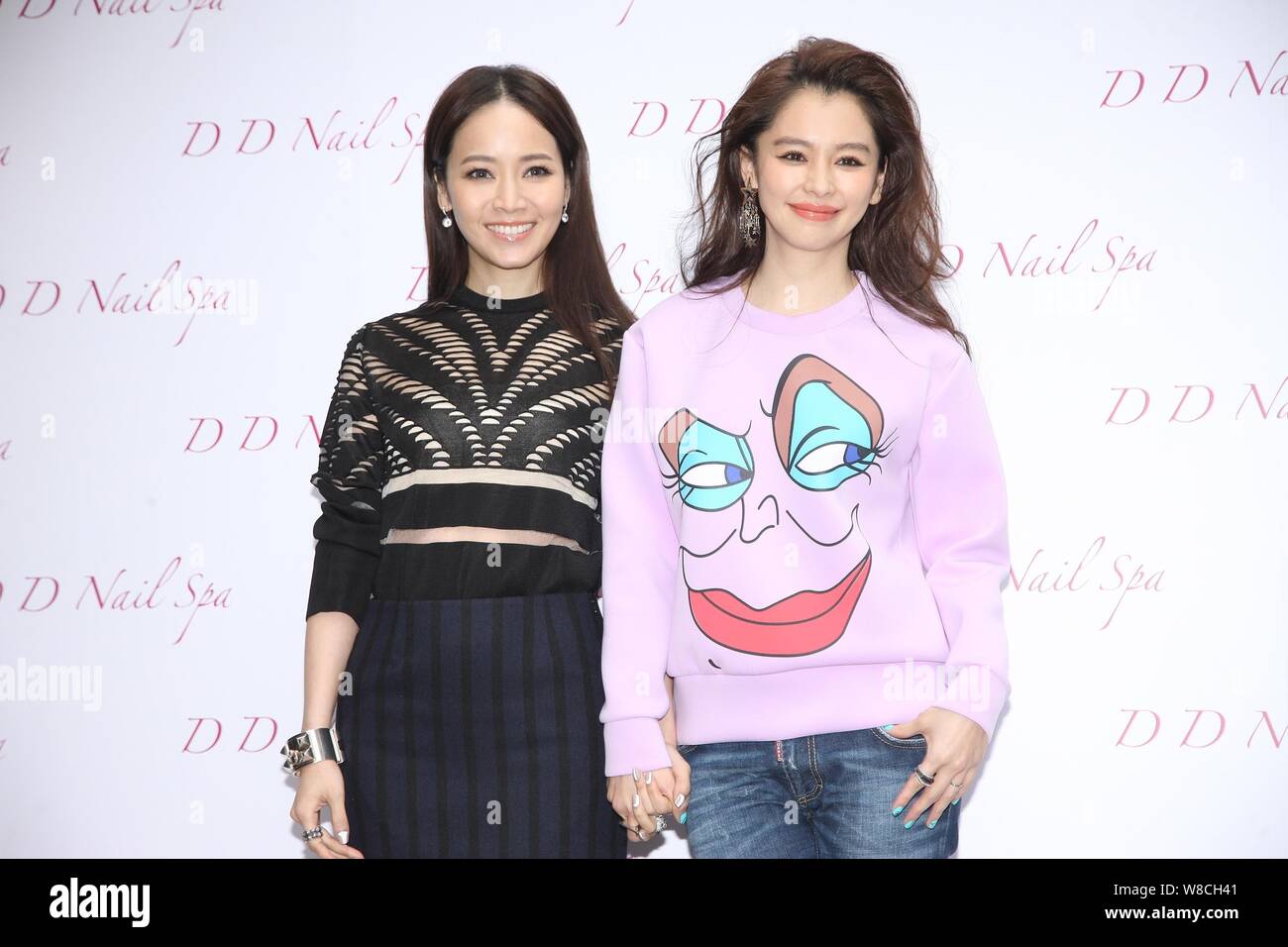 Taiwanese actress Vivian Hsu, right, and TV hostess Patty Hou pose at ...