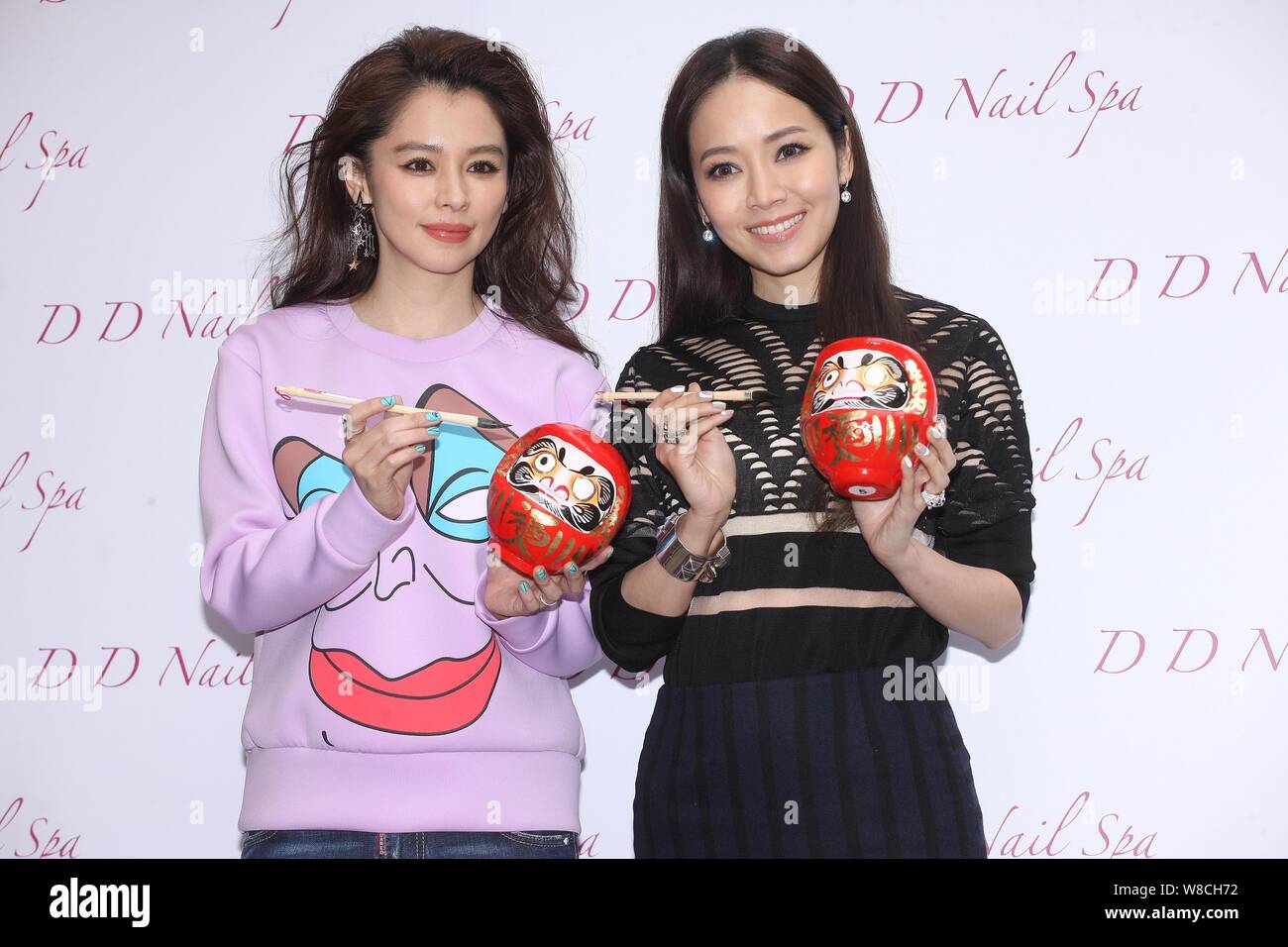 Taiwanese actress Vivian Hsu, left, and TV hostess Patty Hou pose at ...