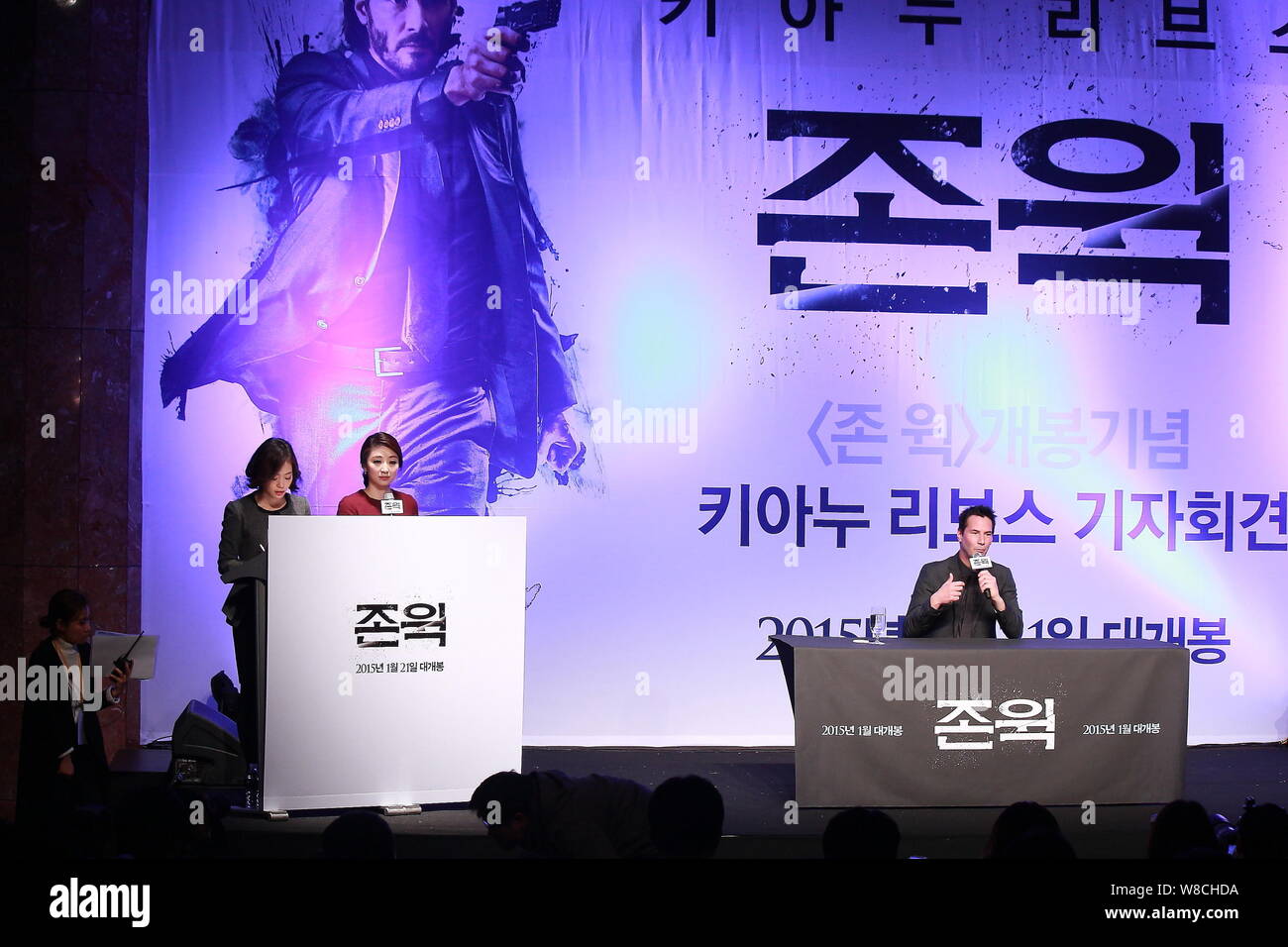 Canadian actor Keanu Reeves, right, speaks during a press conference ...