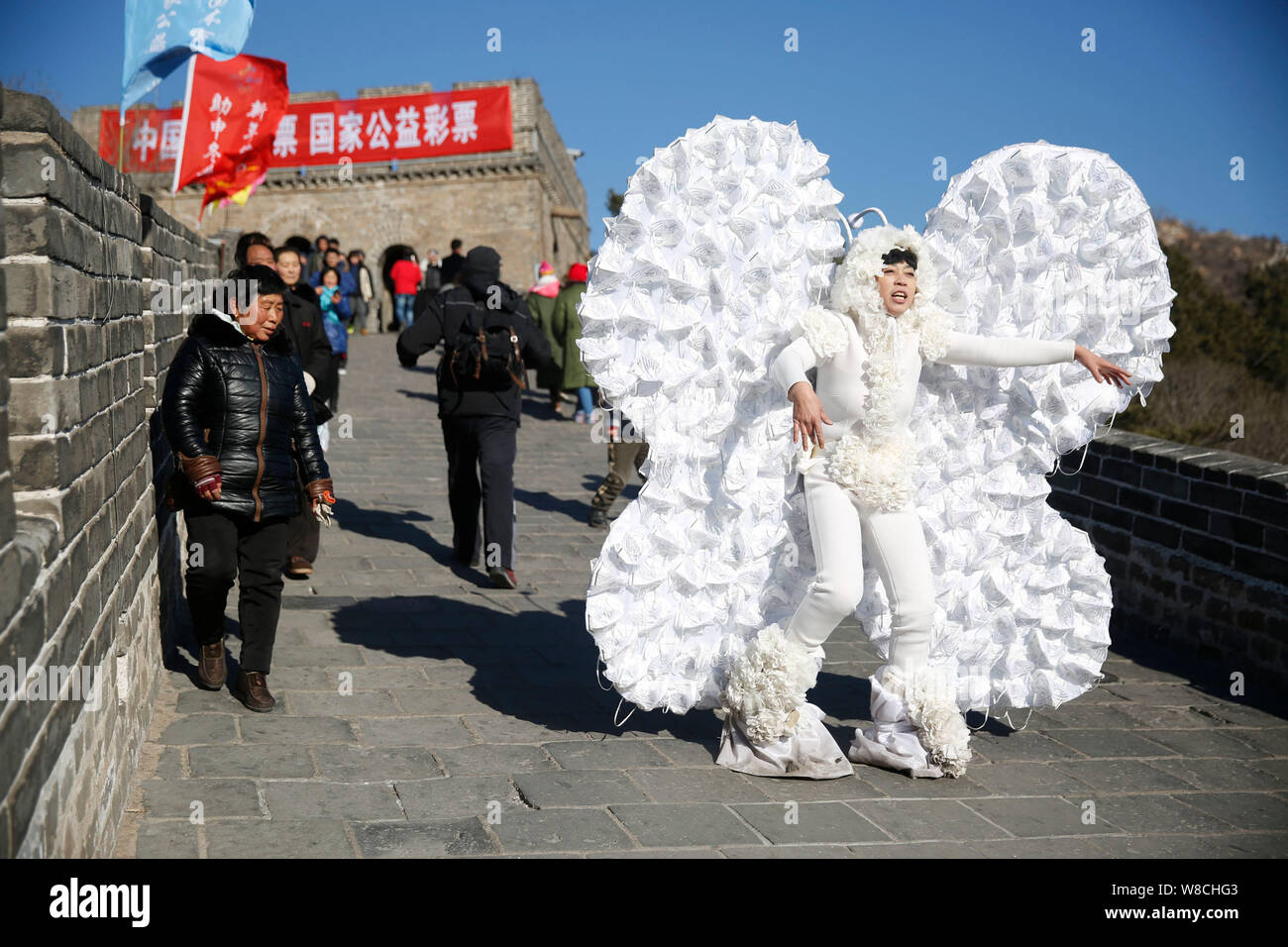 Chinese artist Kong Ning, right, dressed in a butterfly costume made ...