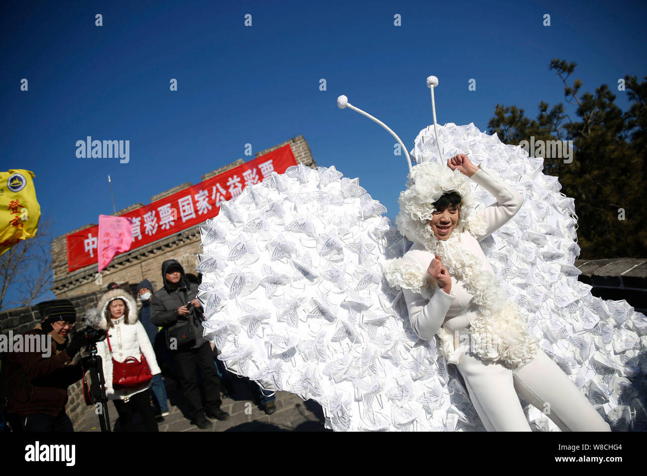 Chinese artist Kong Ning, right, dressed in a butterfly costume made ...