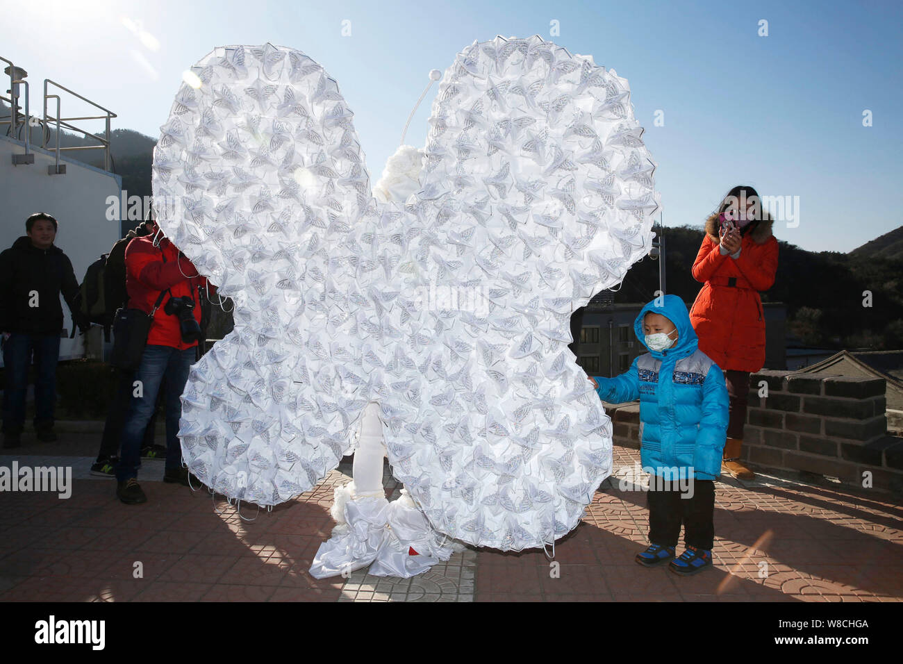 Chinese artist Kong Ning, right, dressed in a butterfly costume made ...