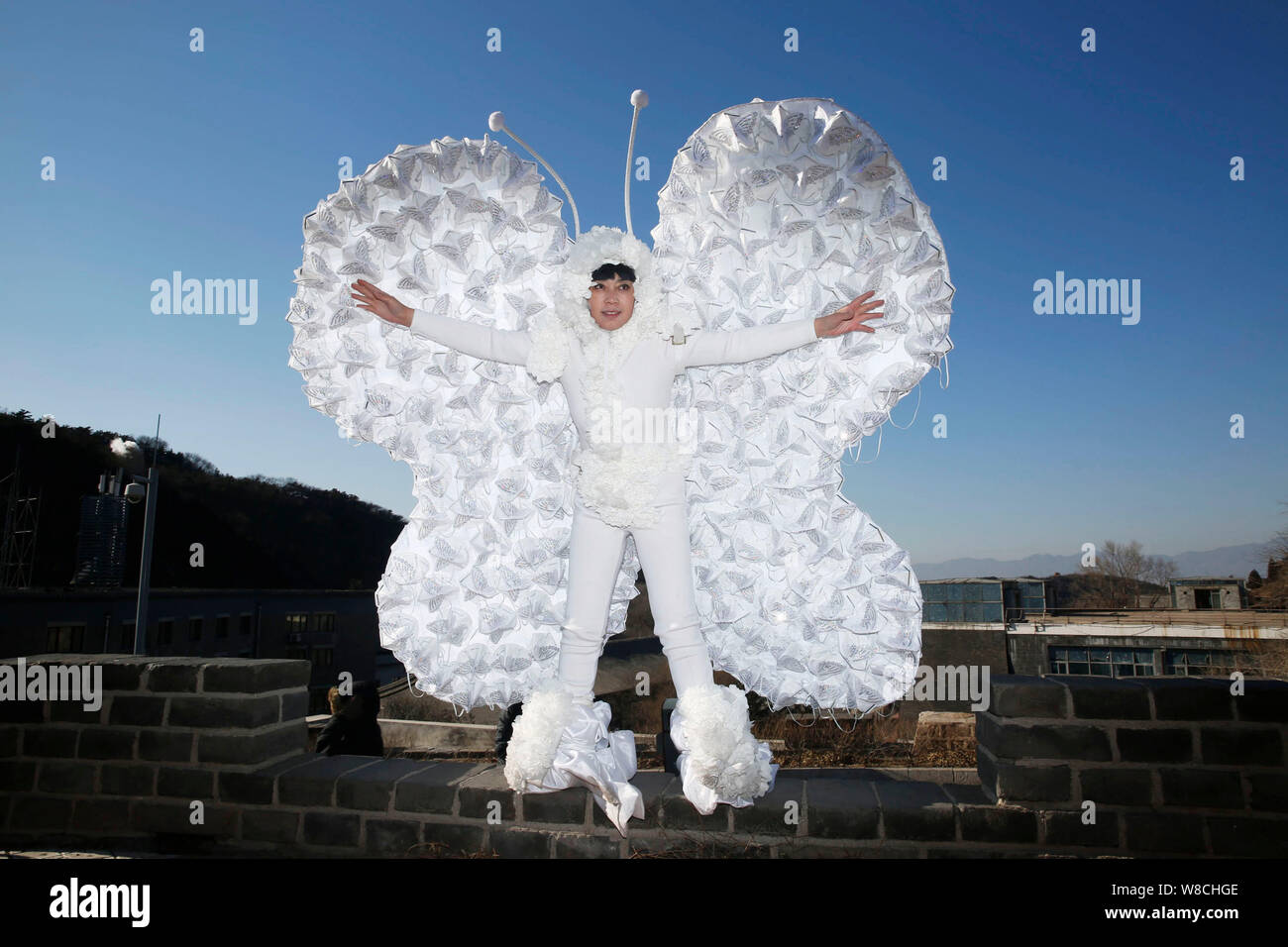 Chinese artist Kong Ning, right, dressed in a butterfly costume made ...