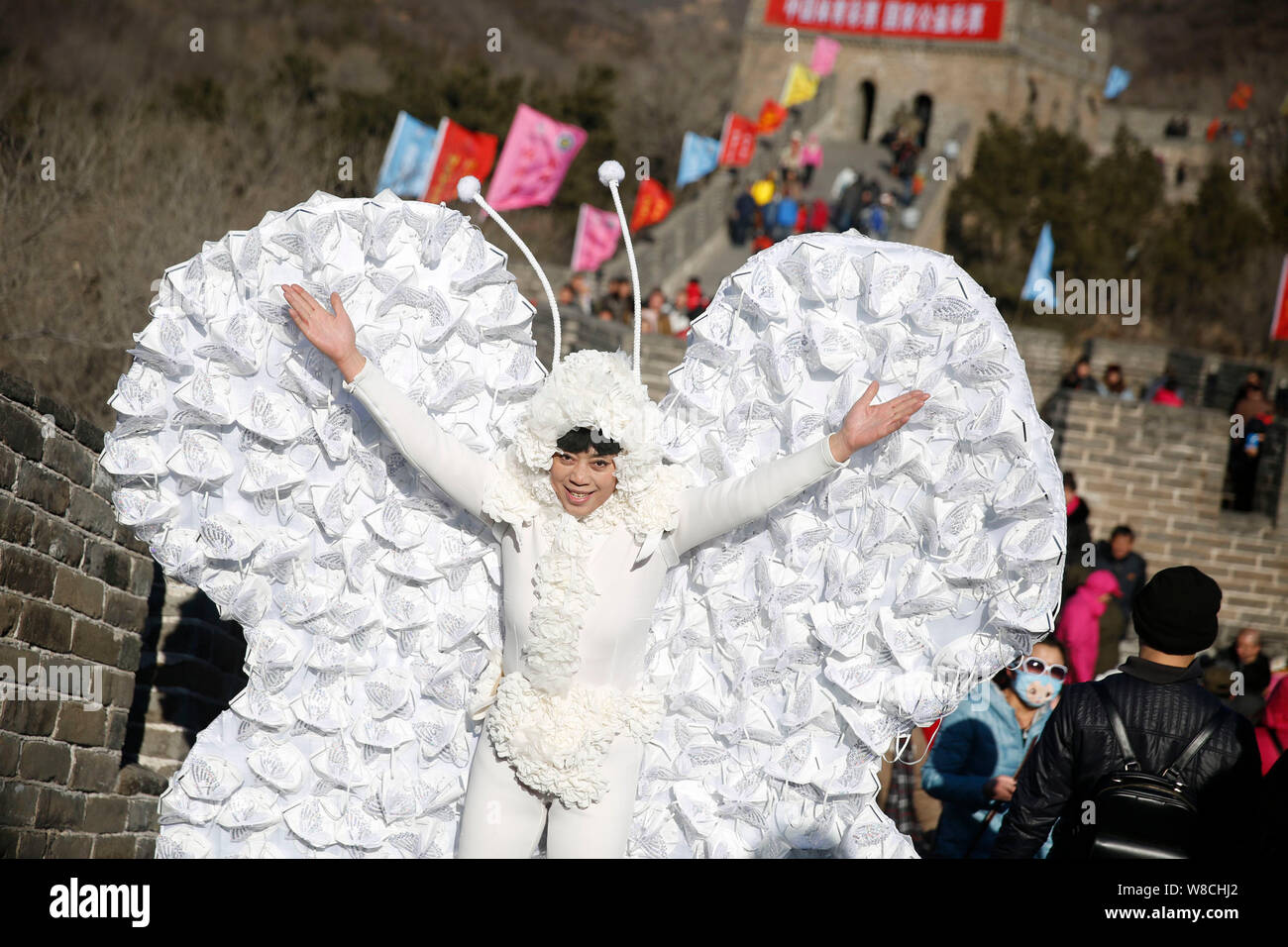 Chinese artist Kong Ning, right, dressed in a butterfly costume made ...