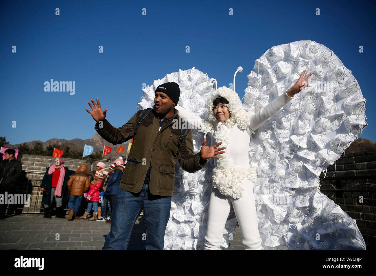 Chinese artist Kong Ning, right, dressed in a butterfly costume made ...