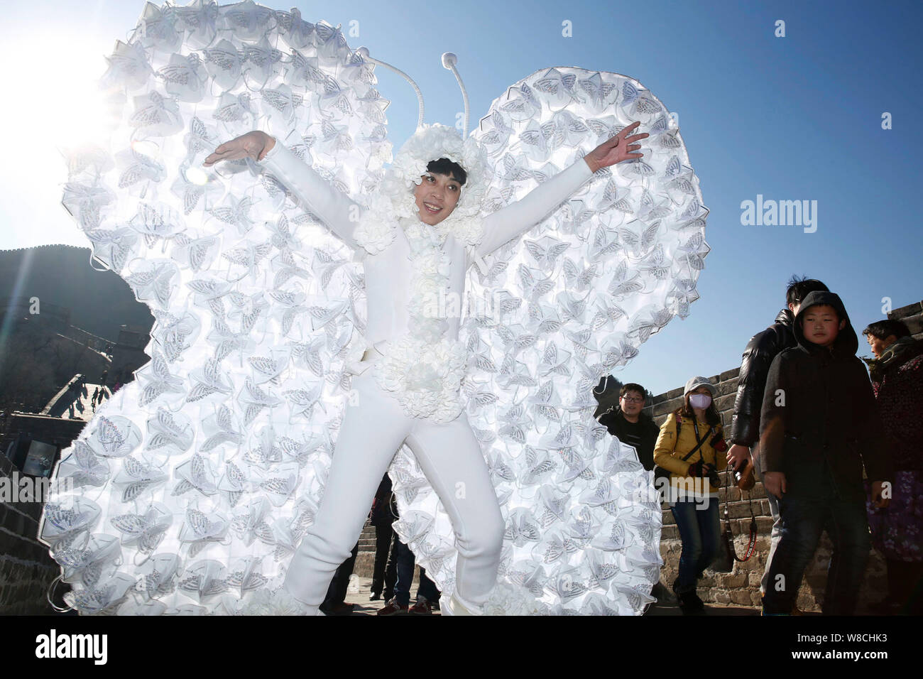 Chinese artist Kong Ning, right, dressed in a butterfly costume made ...