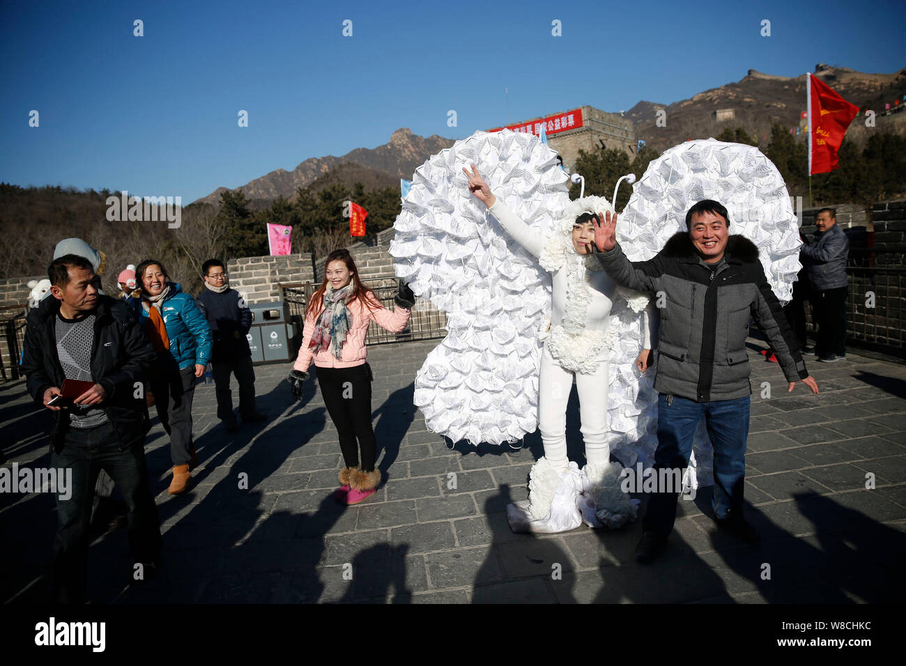 Chinese artist Kong Ning, right, dressed in a butterfly costume made ...