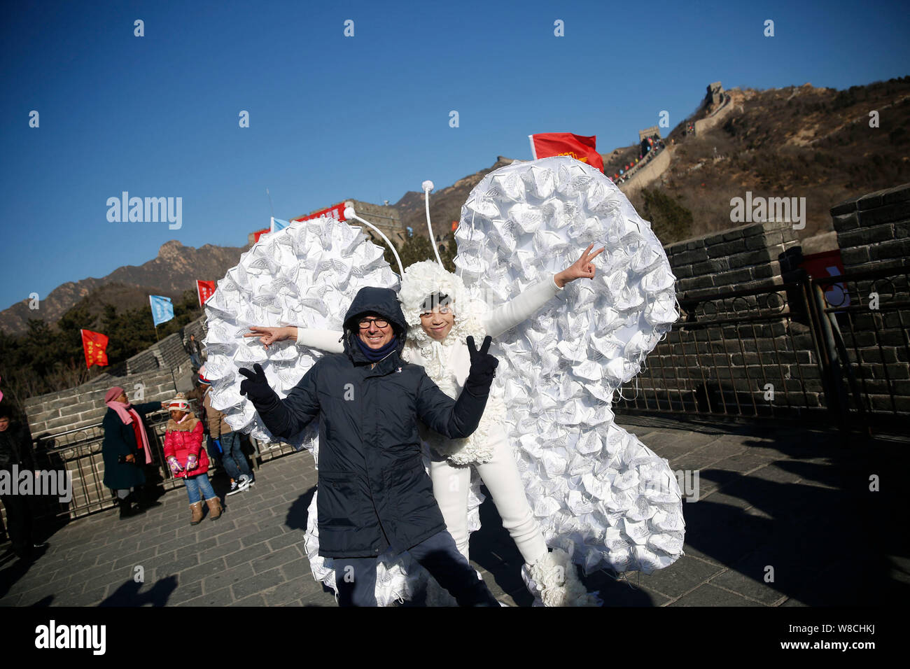 Chinese artist Kong Ning, right, dressed in a butterfly costume made ...