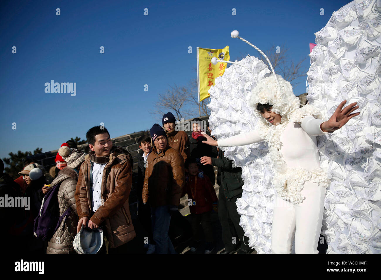 Chinese artist Kong Ning, right, dressed in a butterfly costume made ...