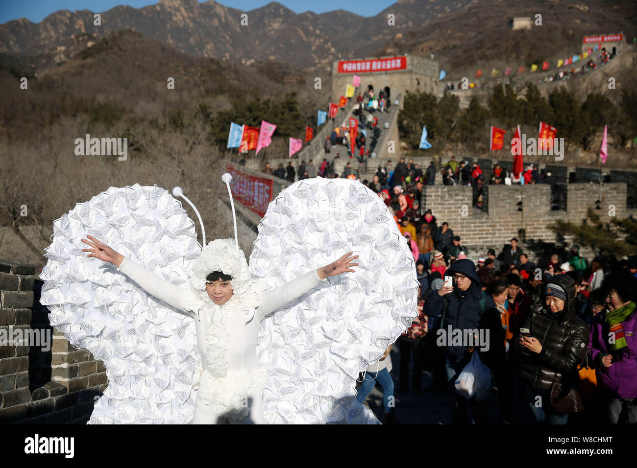 Chinese artist Kong Ning, right, dressed in a butterfly costume made ...