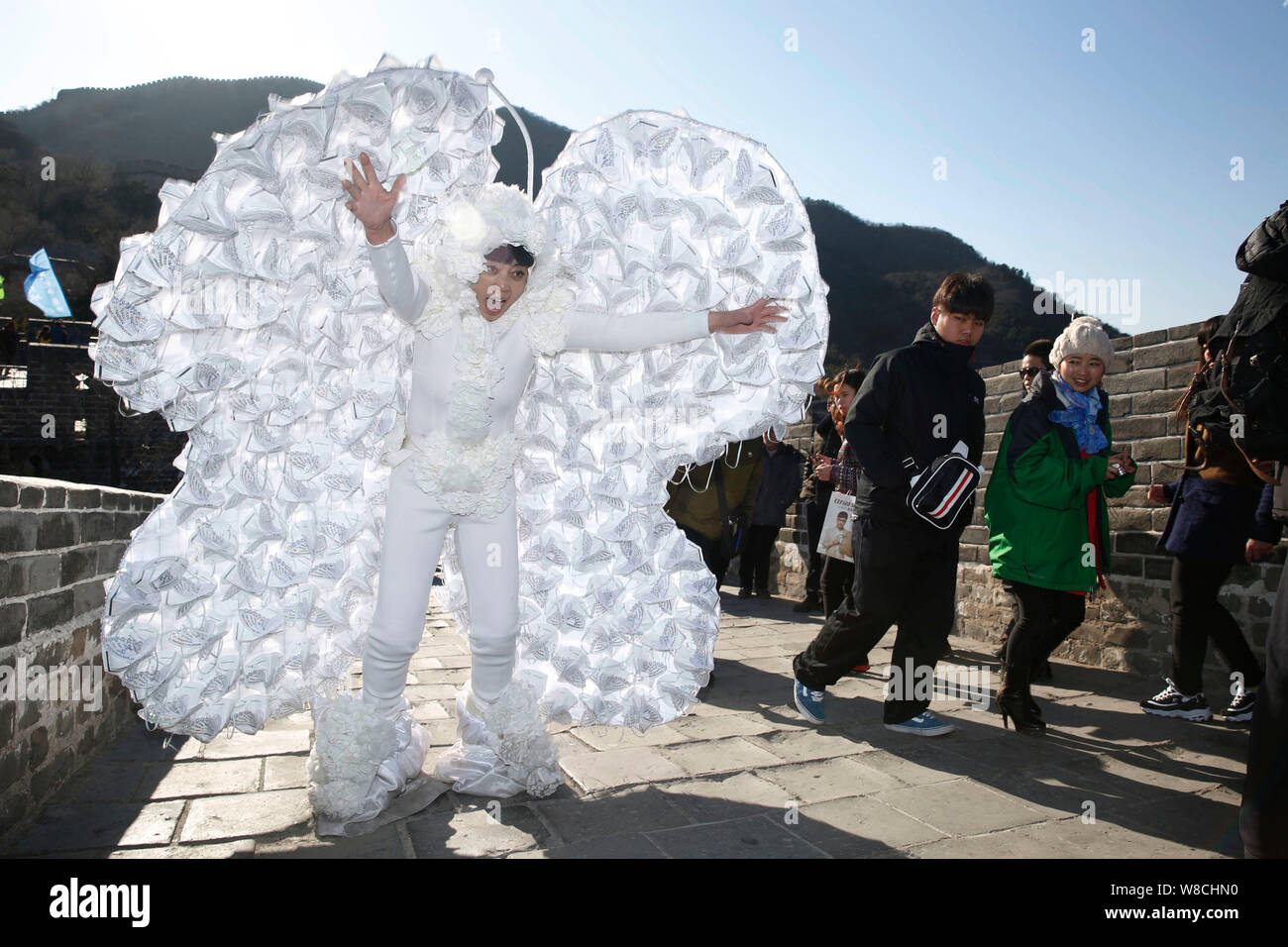 Chinese artist Kong Ning, right, dressed in a butterfly costume made ...