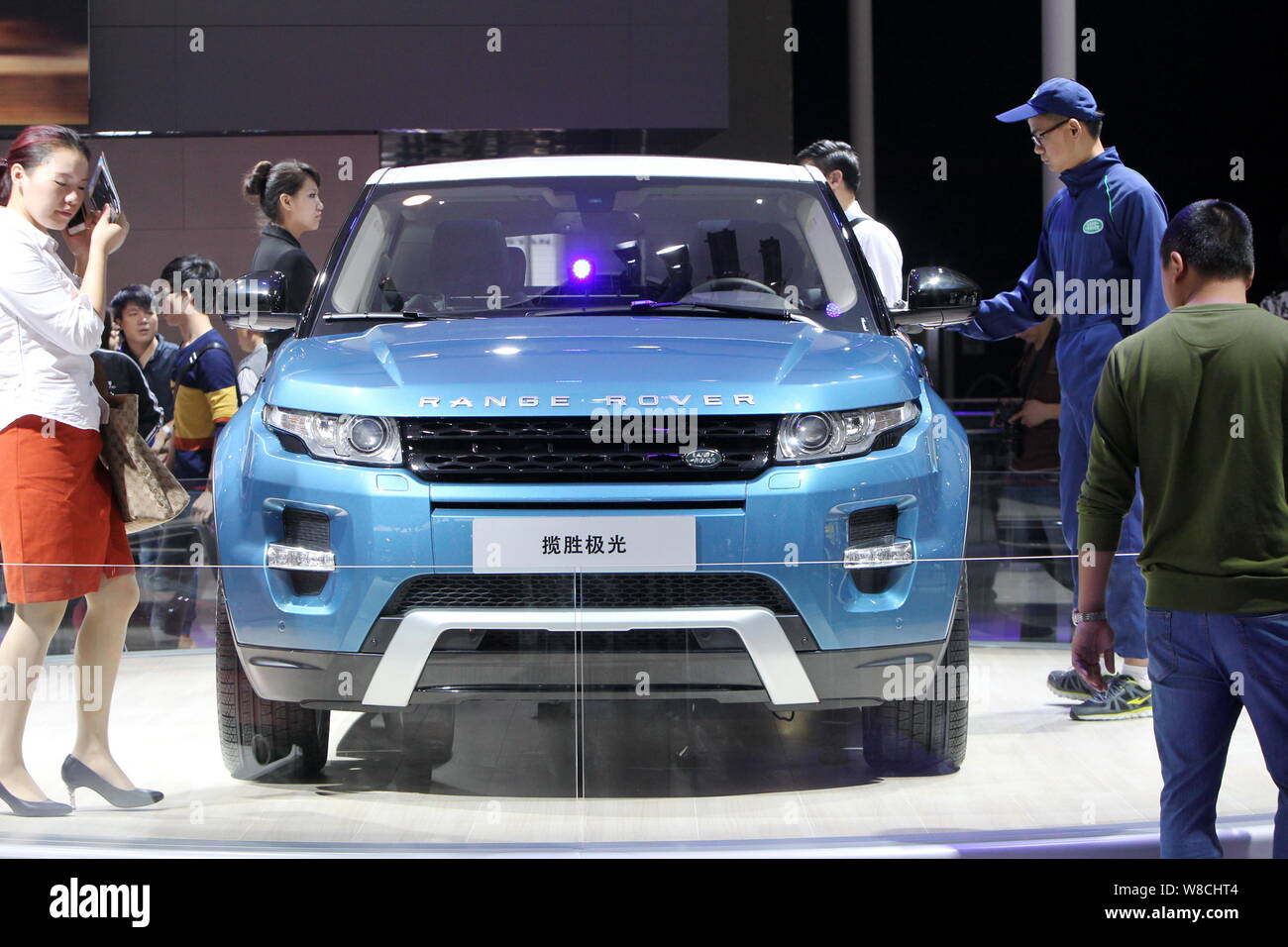 --FILE--Visitors look at a Range Rover Evoque SUV of Jaguar Land Rover ...