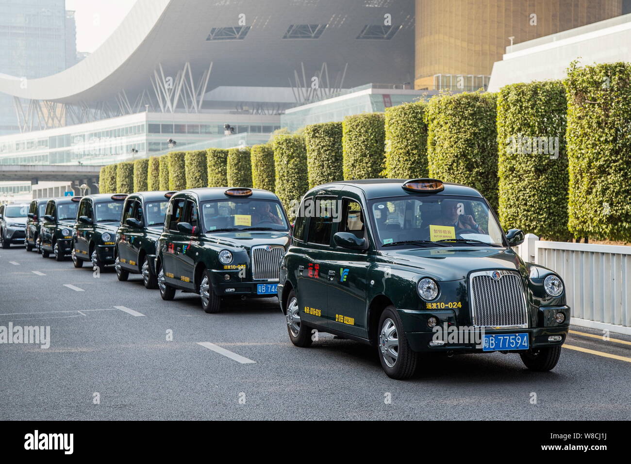 --FILE--Geely Englon TX4 taxi cars travel on a road in Shenzhen city ...