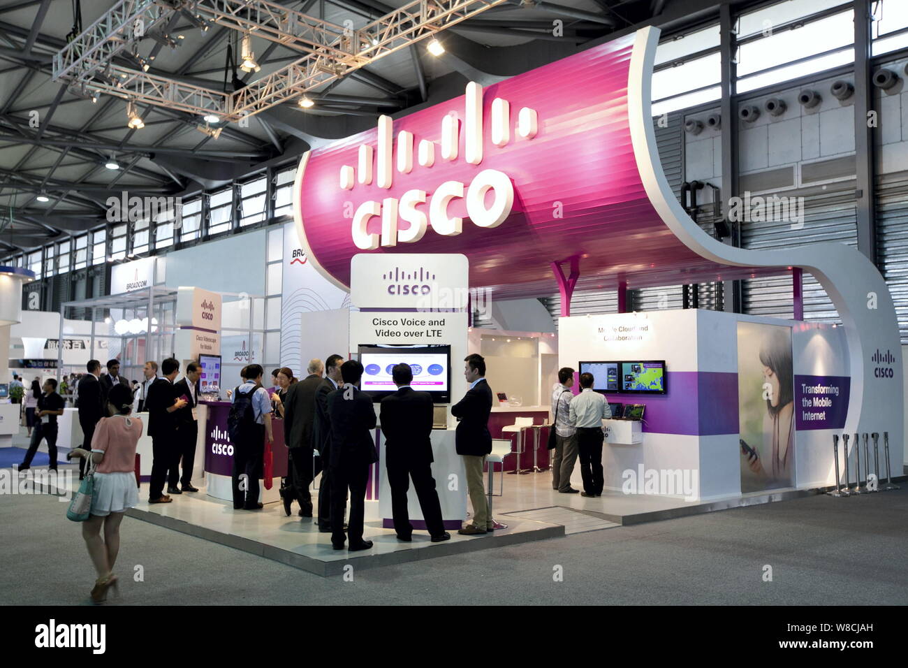--FILE--People visit the stand of Cisco Systems during the Mobile Asia ...