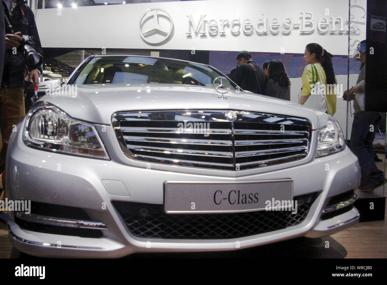 --FILE--Visitors look at a Mercedes-Benz C-Class during the 12th ...
